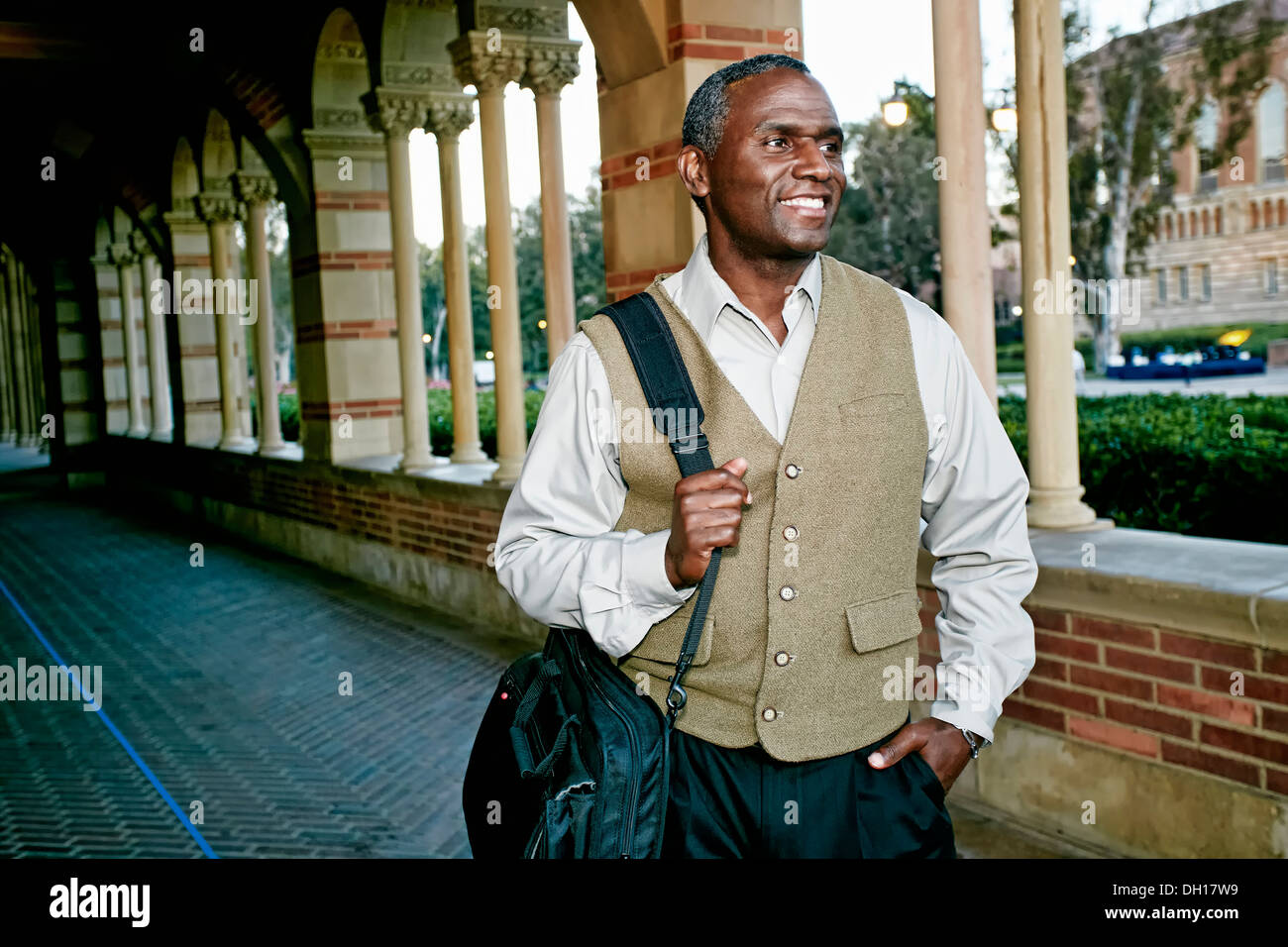 African American professor smiling on campus Stock Photo - Alamy