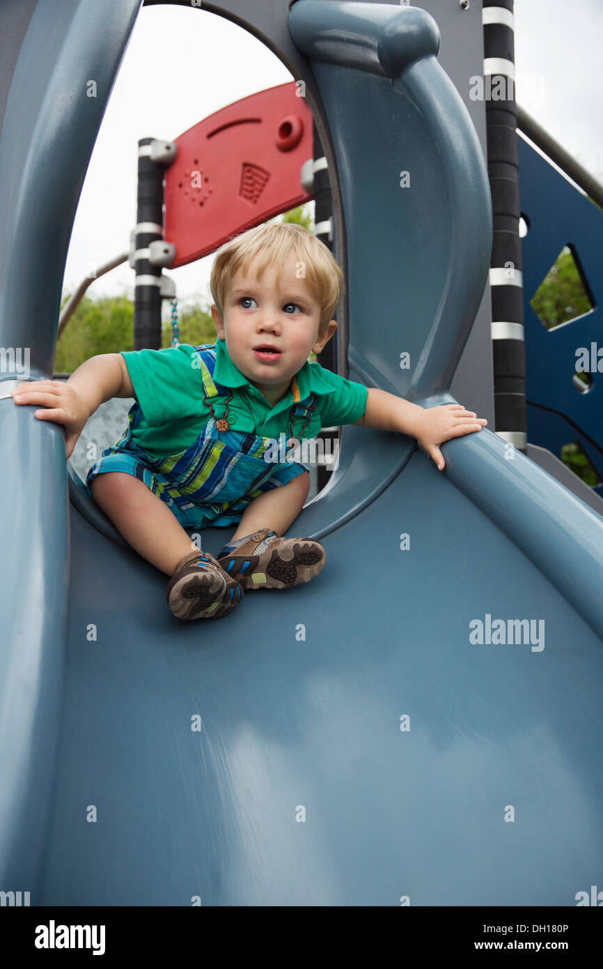 Children playing on playground slide hi-res stock photography and ...