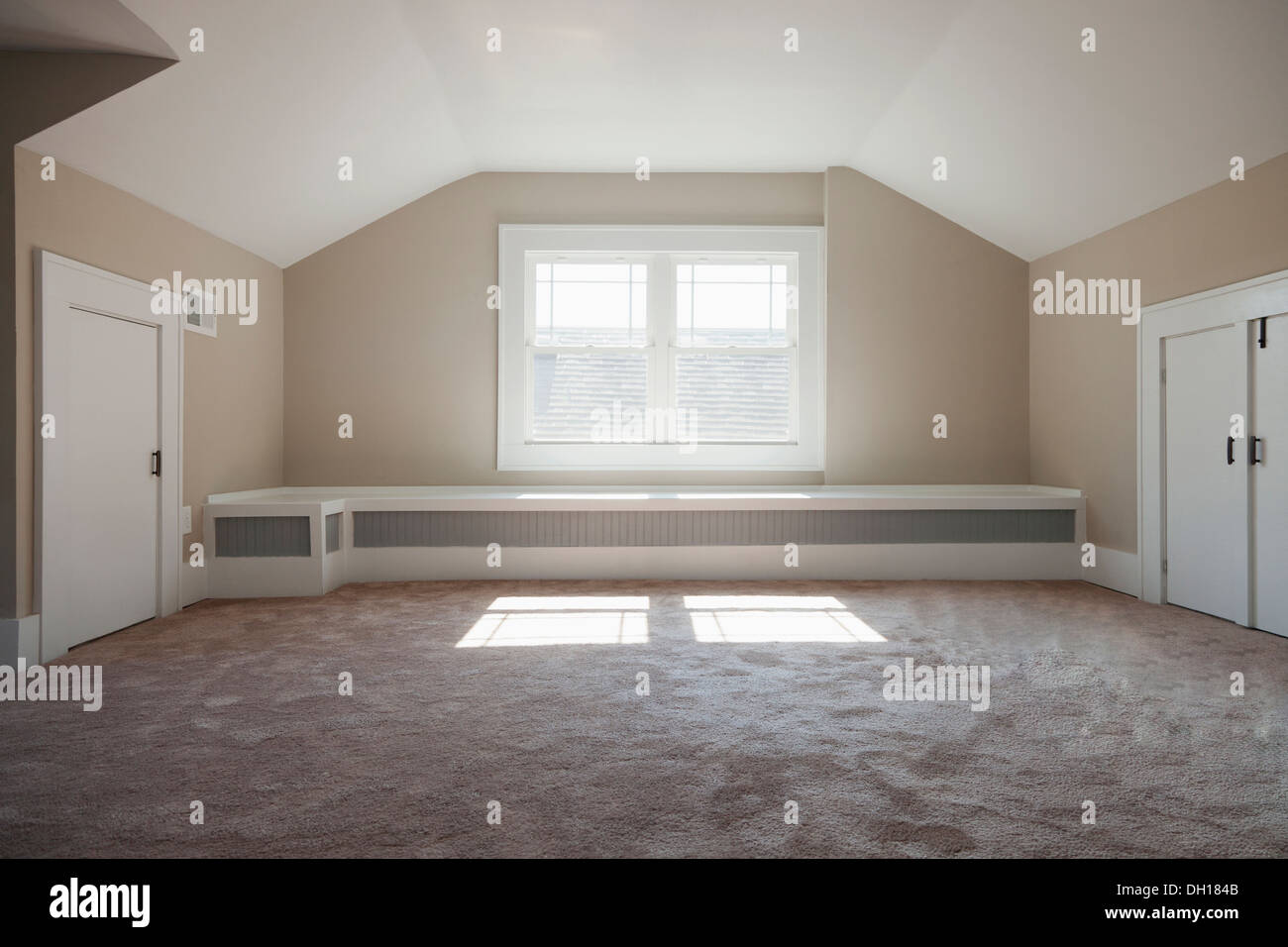 Window in empty attic room Stock Photo - Alamy
