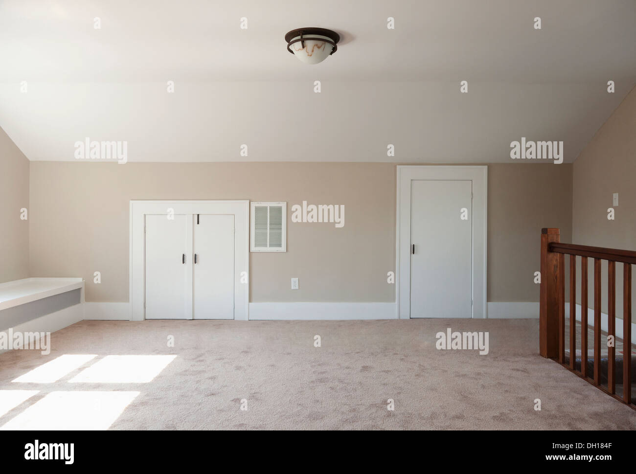Closets in empty attic room Stock Photo - Alamy