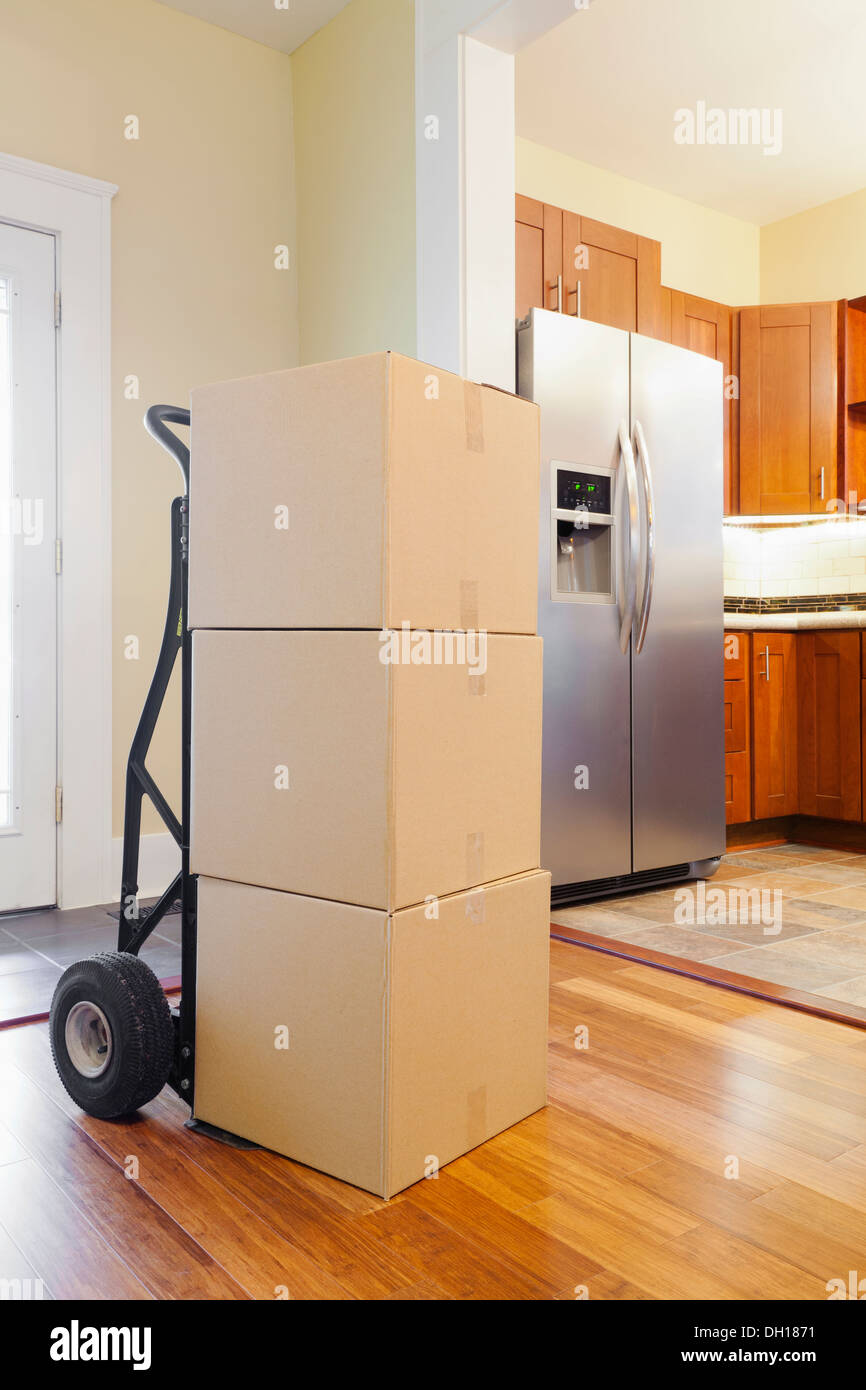 Cardboard boxes in new house Stock Photo - Alamy