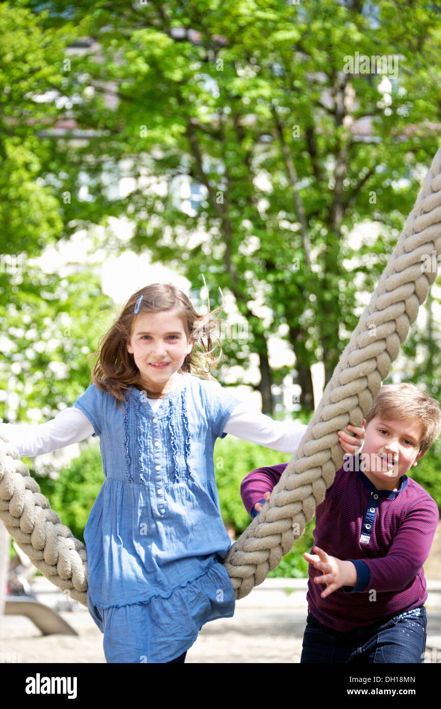 Children playing on ropes in the playground, Munich, Bavaria, Germany ...