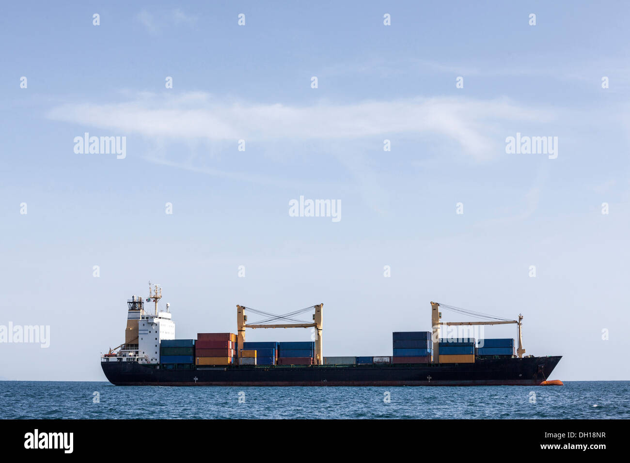 Cargo ship in ocean Stock Photo - Alamy