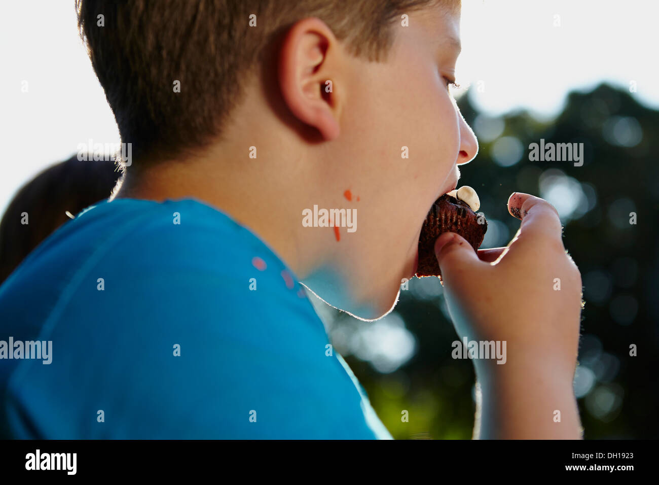Boy eating party food hi-res stock photography and images - Alamy