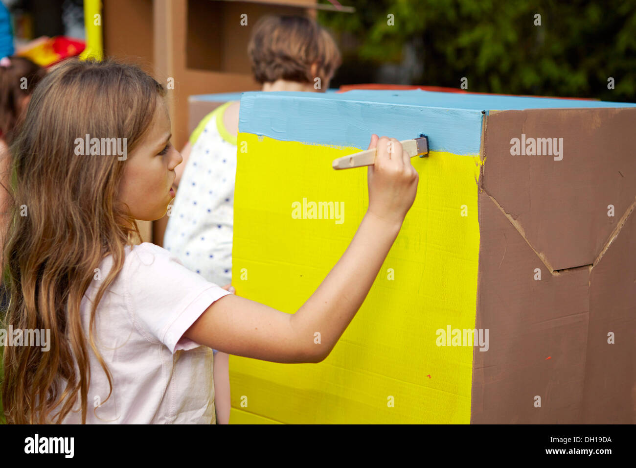 Girl painting cardboard box, Munich, Bavaria, Germany Stock Photo - Alamy