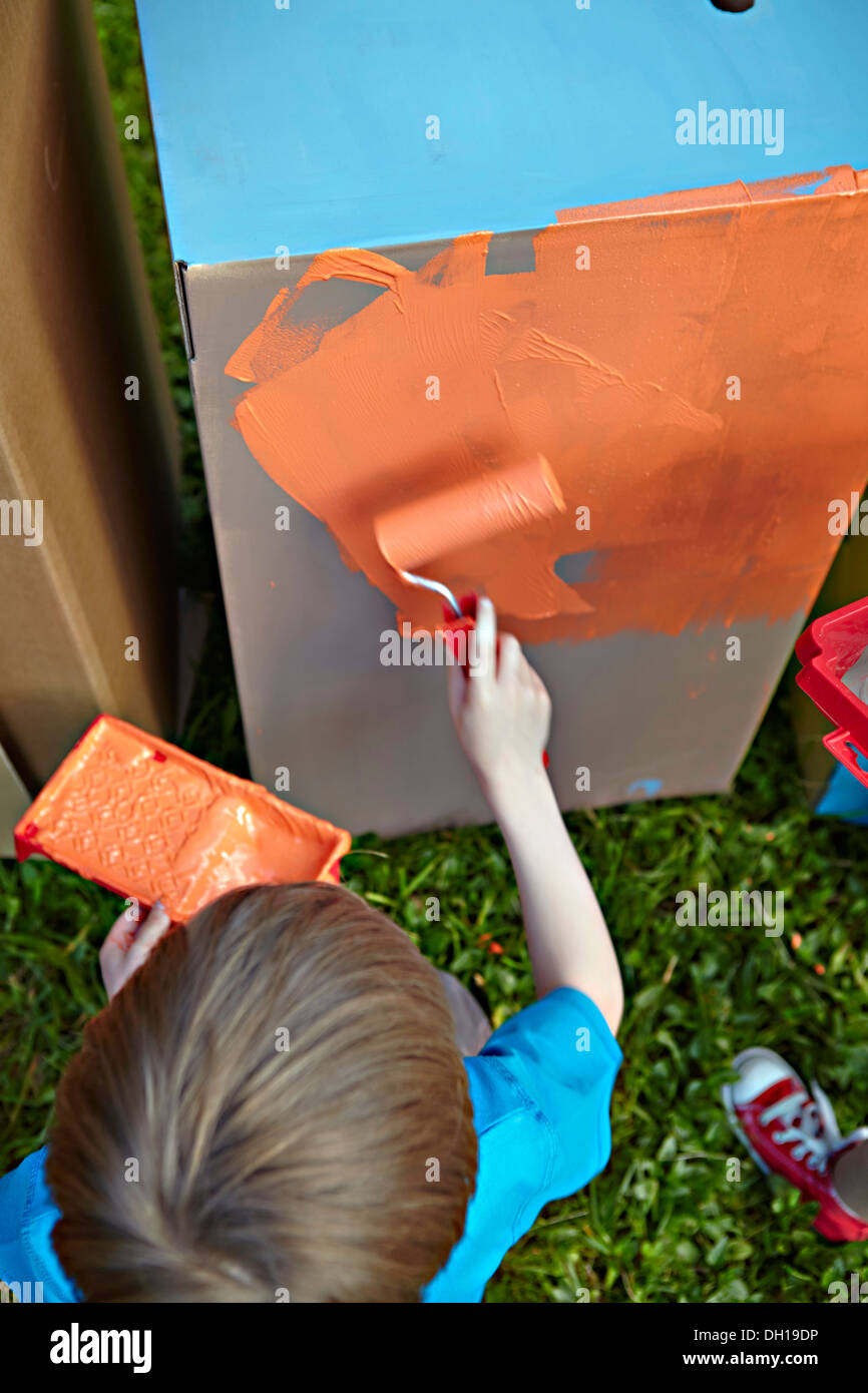 Boy painting cardboard box, Munich, Bavaria, Germany Stock Photo - Alamy