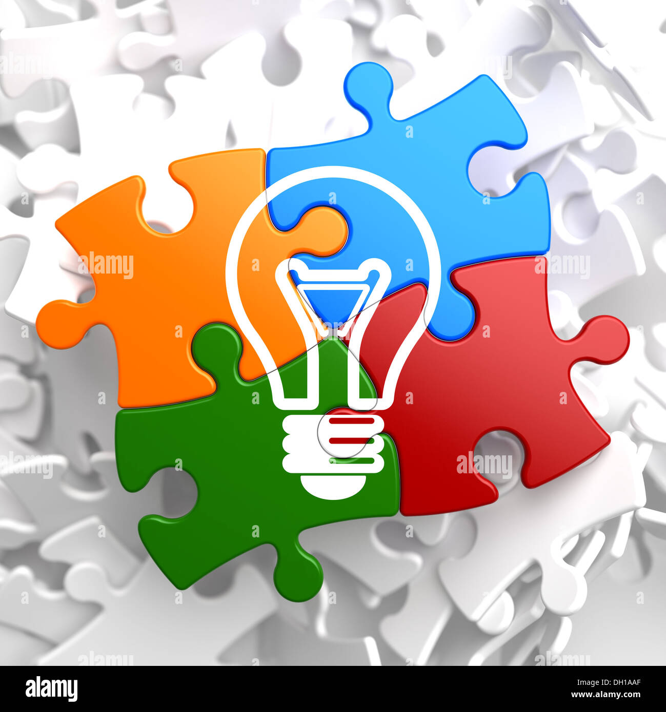 Light Bulb Icon on Multicolor Puzzle Stock Photo - Alamy