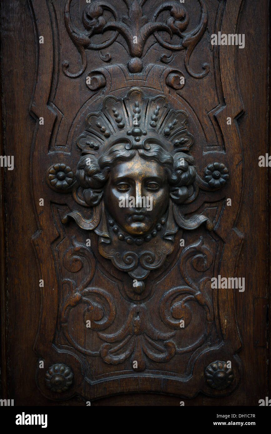 Bronze of woman's face forms a traditional front door decoration in ...