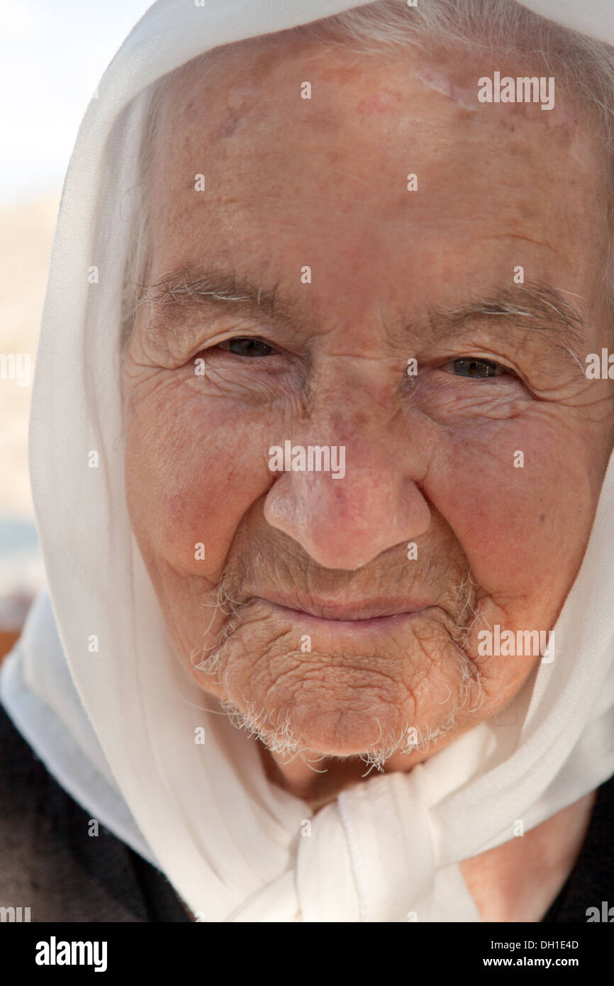 Street portrait of a friendly old lady with a sweet smile from Damasta ...