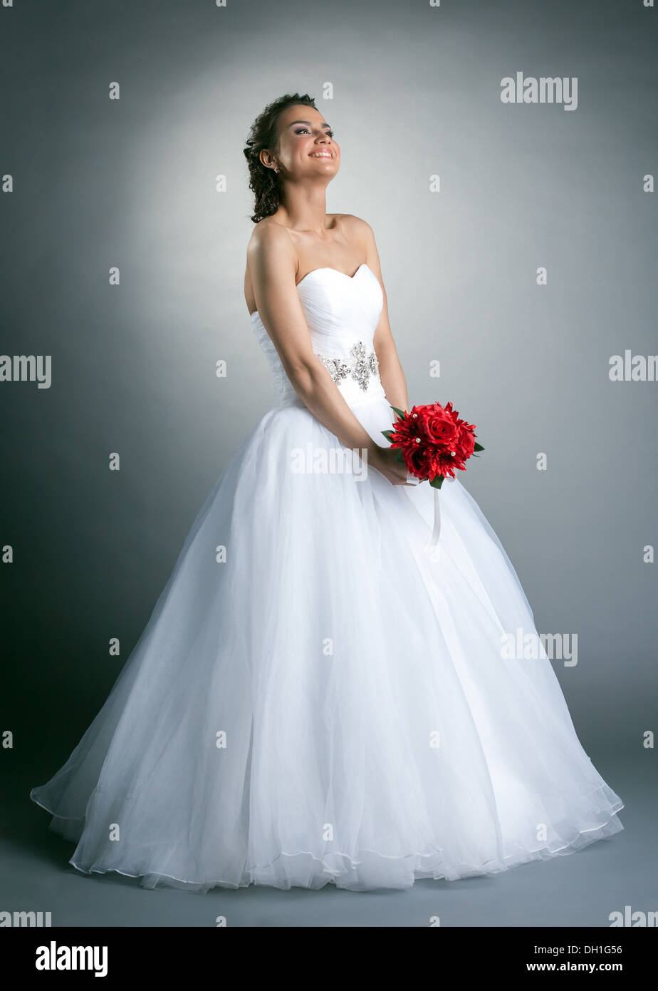 Beautiful slim bride posing in studio Stock Photo - Alamy