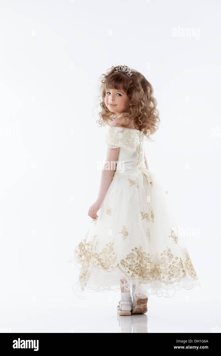 Smiling young princess posing in studio Stock Photo - Alamy