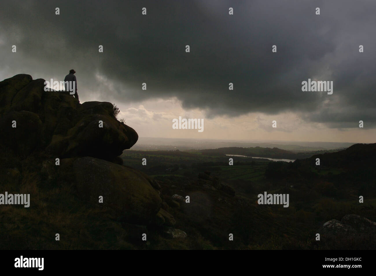 A Teenager Standing On Rock Formations Known As The "Roaches" On The ...