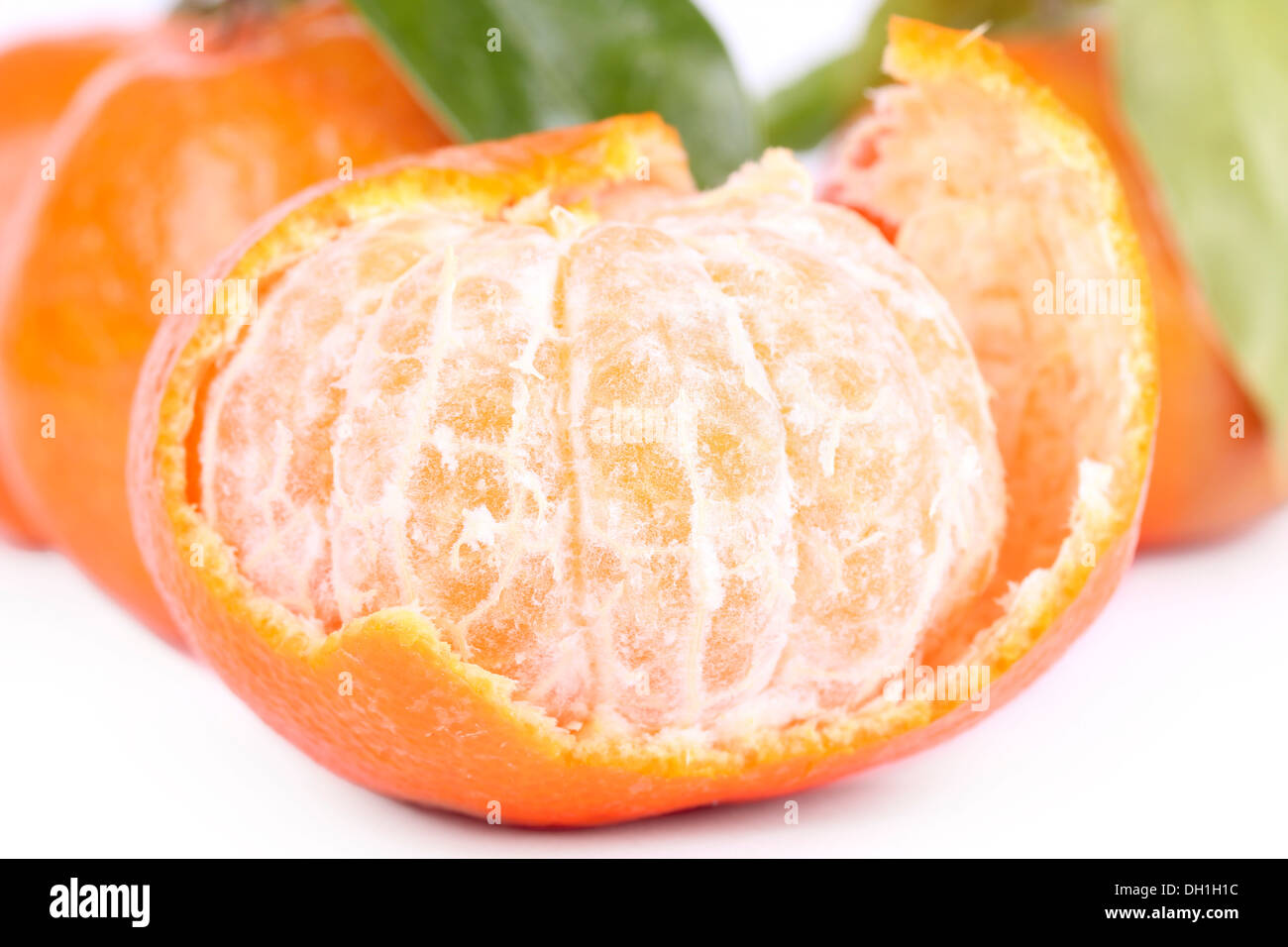 Open mandarin closeup on white background Stock Photo - Alamy