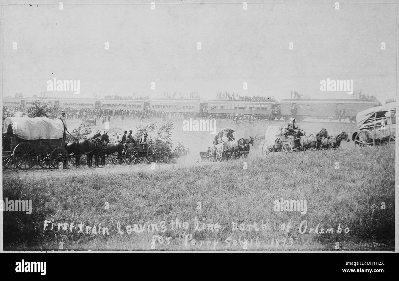 This photograph shows the first train and wagons leaving the line north ...