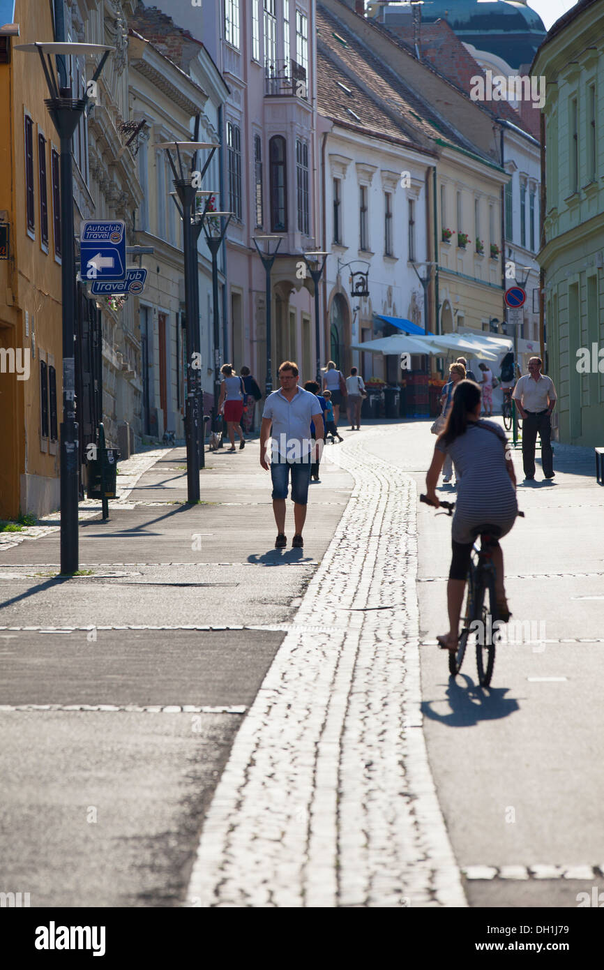 People walking along street, Pecs, Southern Transdanubia, Hungary Stock ...