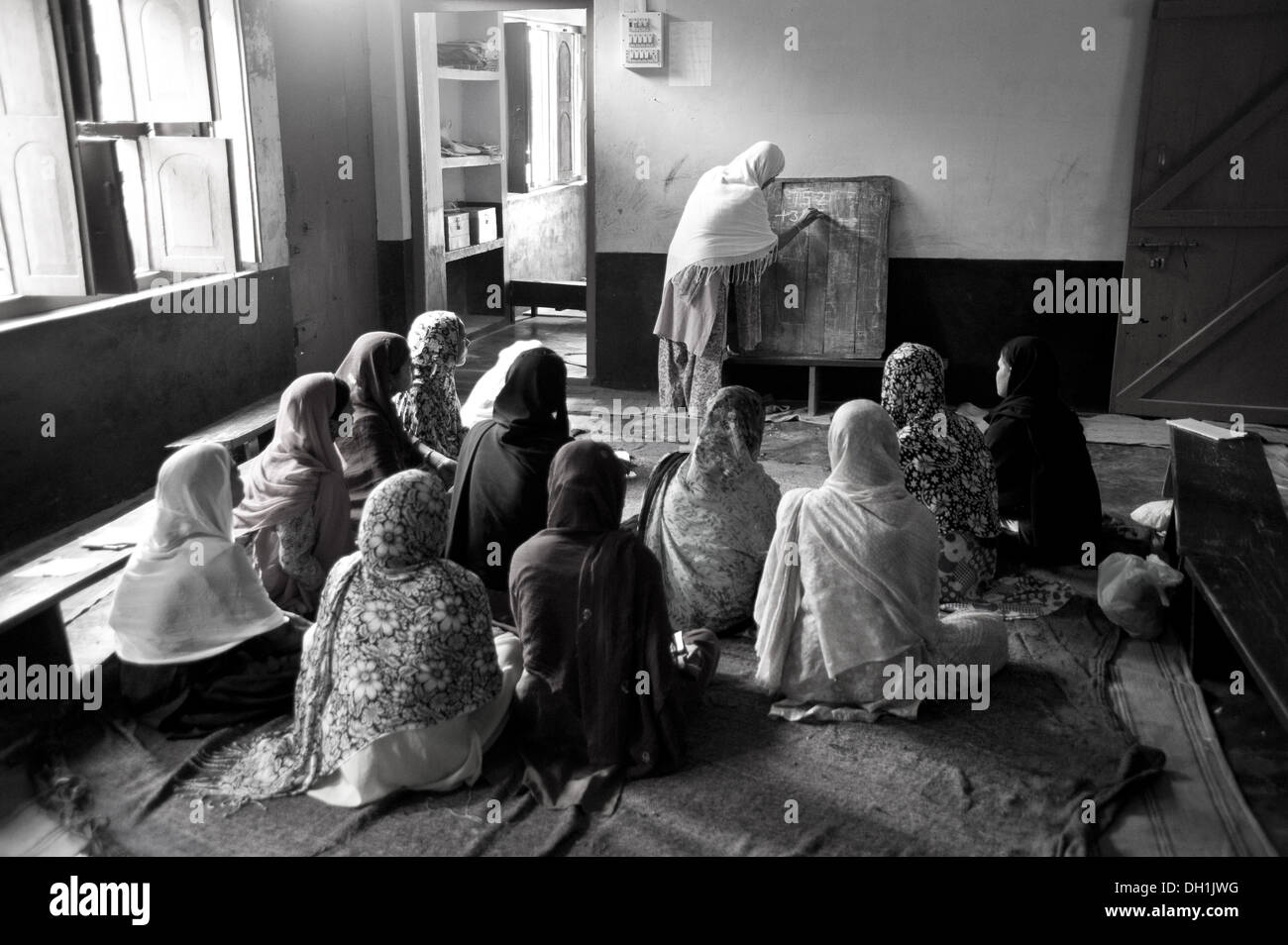 Muslim teacher with children in classroom Islamic school uttar pradesh ...