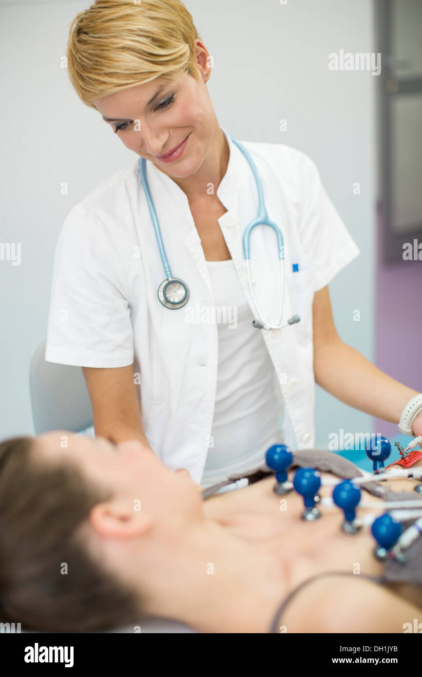Electrocardiogram female patient undergoing hi-res stock photography ...