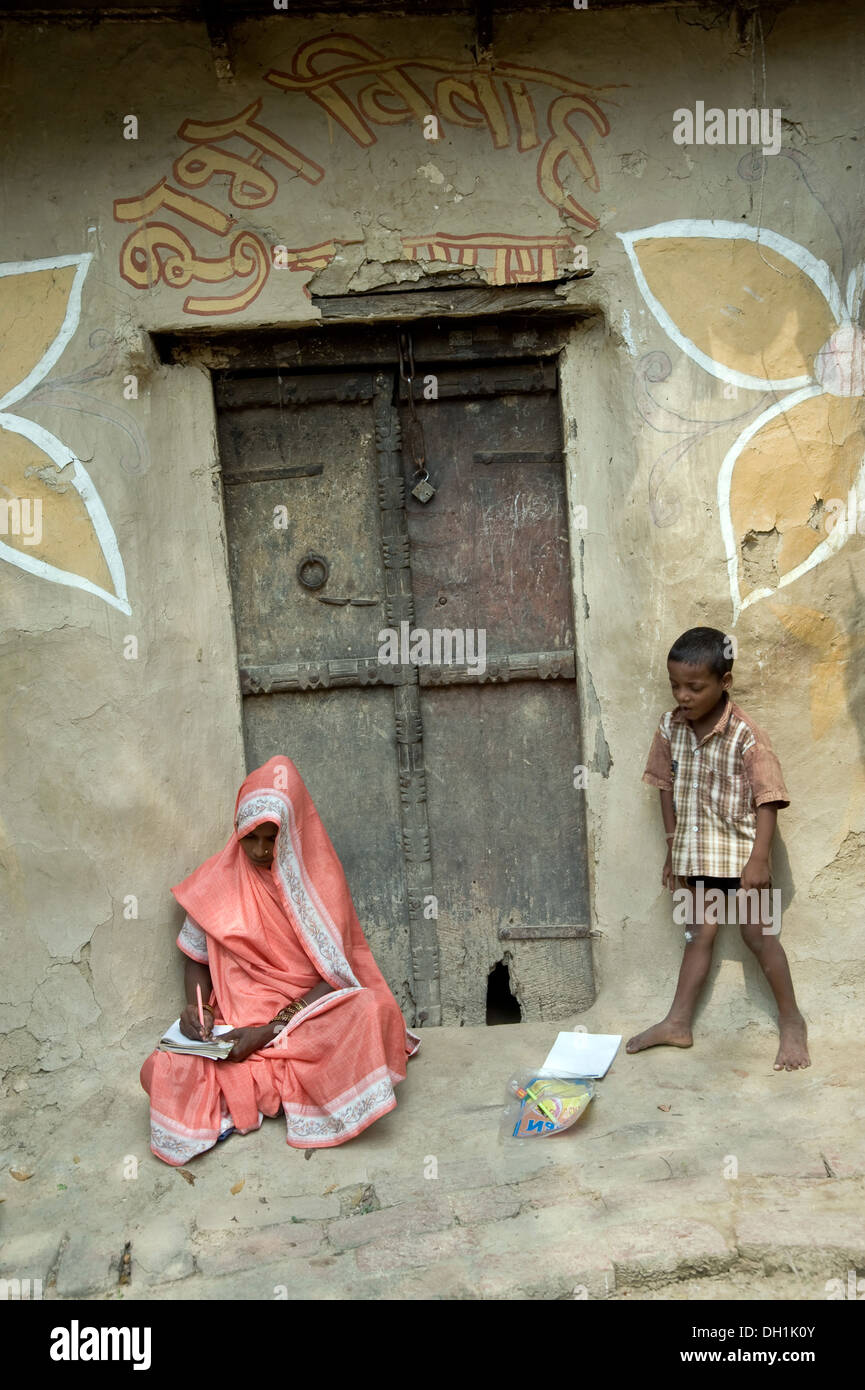 Rural senior woman studying , varanasi , uttar pradesh , India , Asia ...
