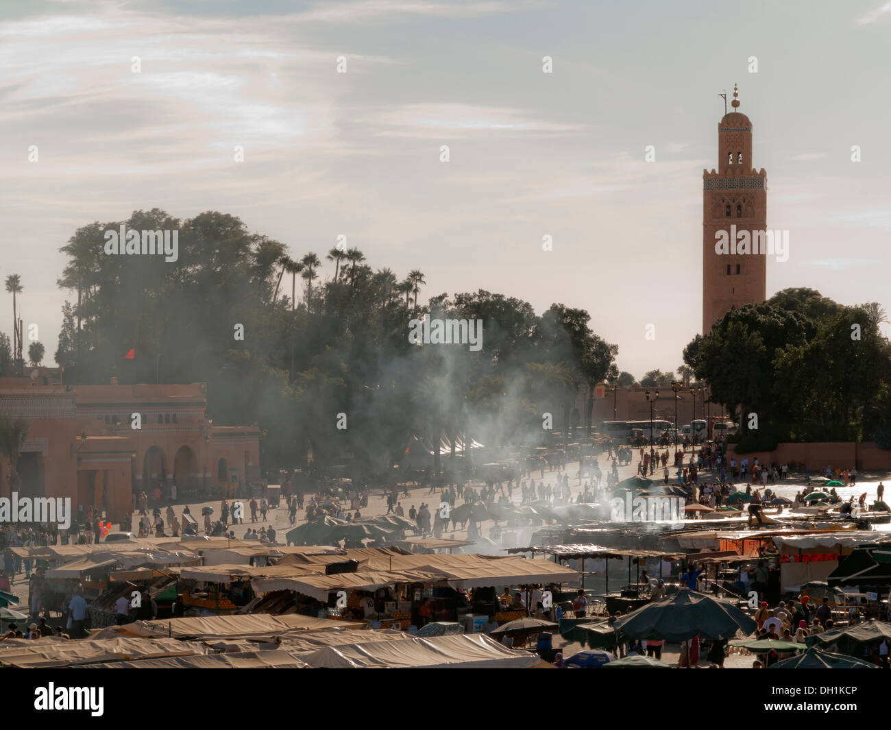 The sun setting through cooking smoke in Jemaa el Fna square Marrakech ...