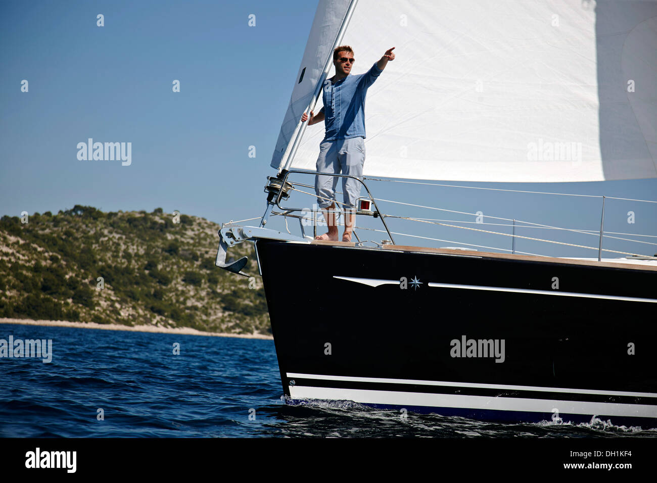 Man pointing on sailboat hi-res stock photography and images - Alamy