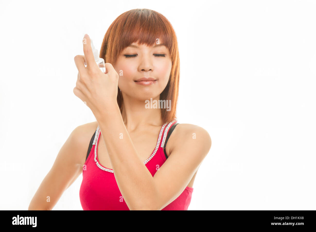 Chinese woman with spray bottle spraying hair Stock Photo - Alamy