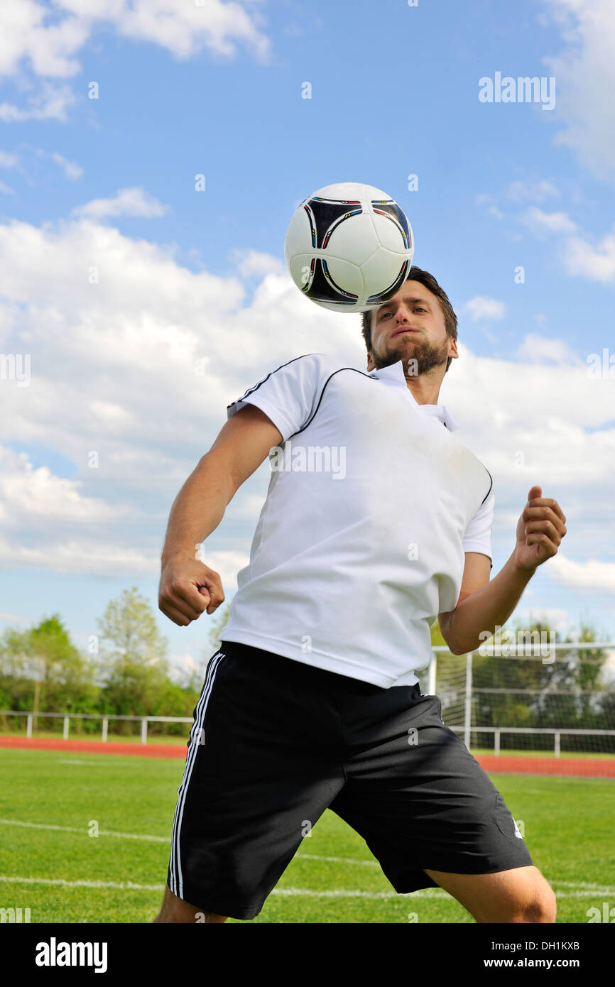 Soccer player heading the ball, Munich, Bavaria, Germany Stock Photo ...