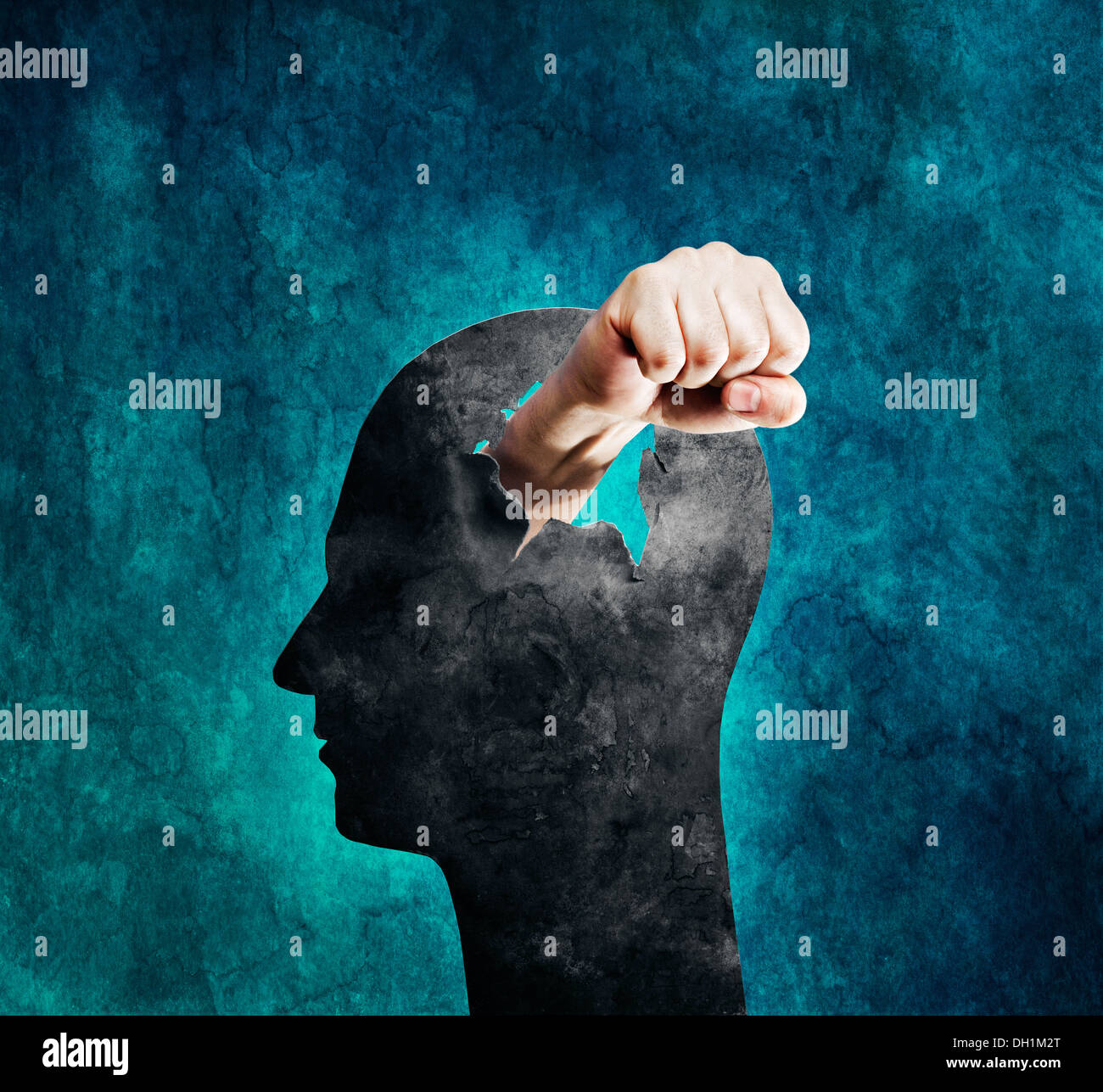 Conceptual image of a fist punching through a cardboard head Stock ...