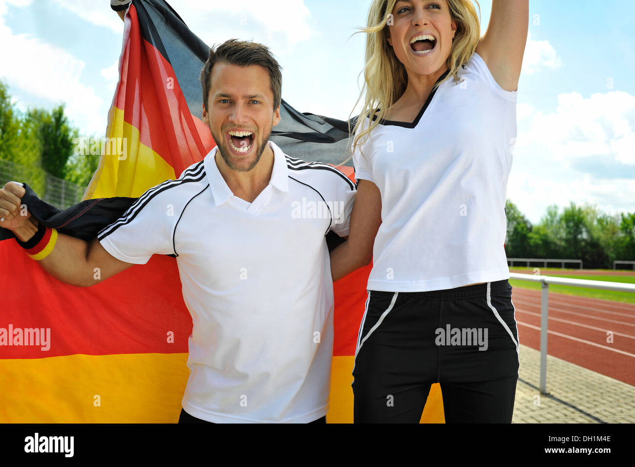 Soccer fans waving German flag, Munich, Bavaria, Germany Stock Photo ...