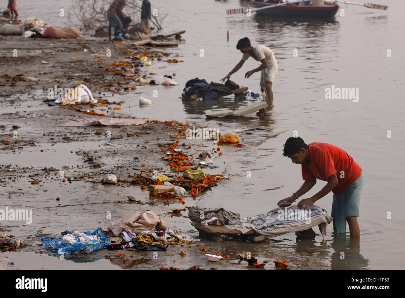 men washing clothes ganga river ganges varanasi uttar pradesh India ...