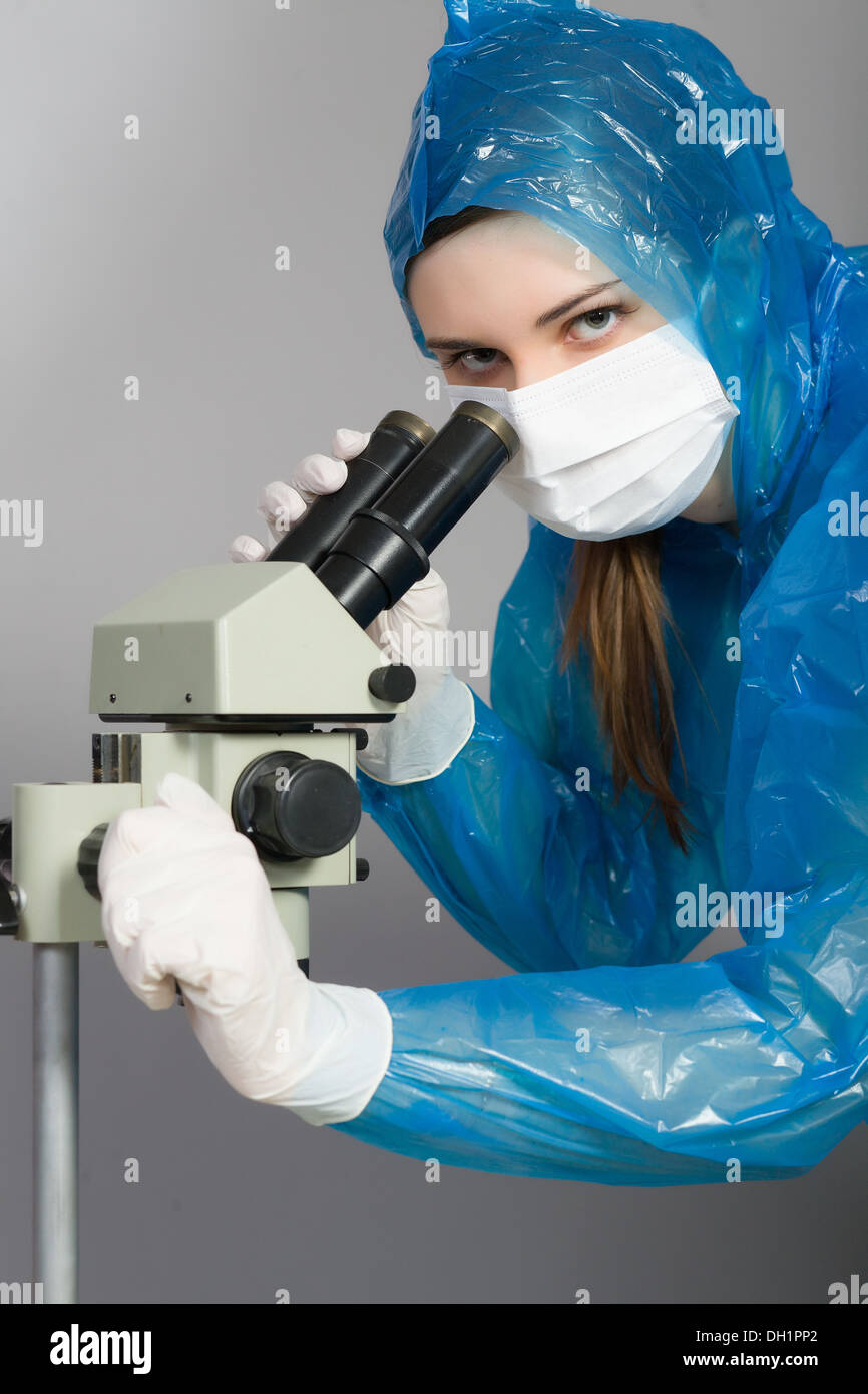 Closeup woman looking through microscope hi-res stock photography and ...