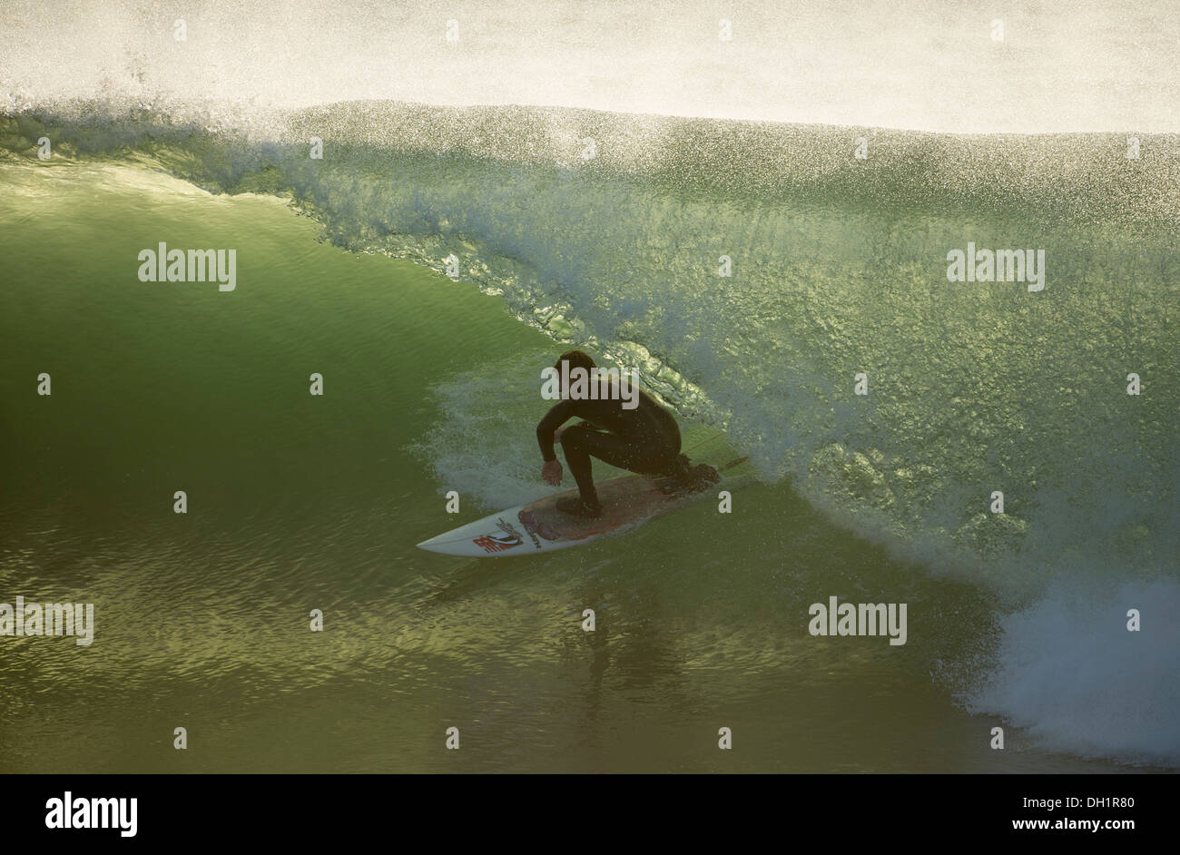 surfer in a tube, false bay sunset light Stock Photo - Alamy