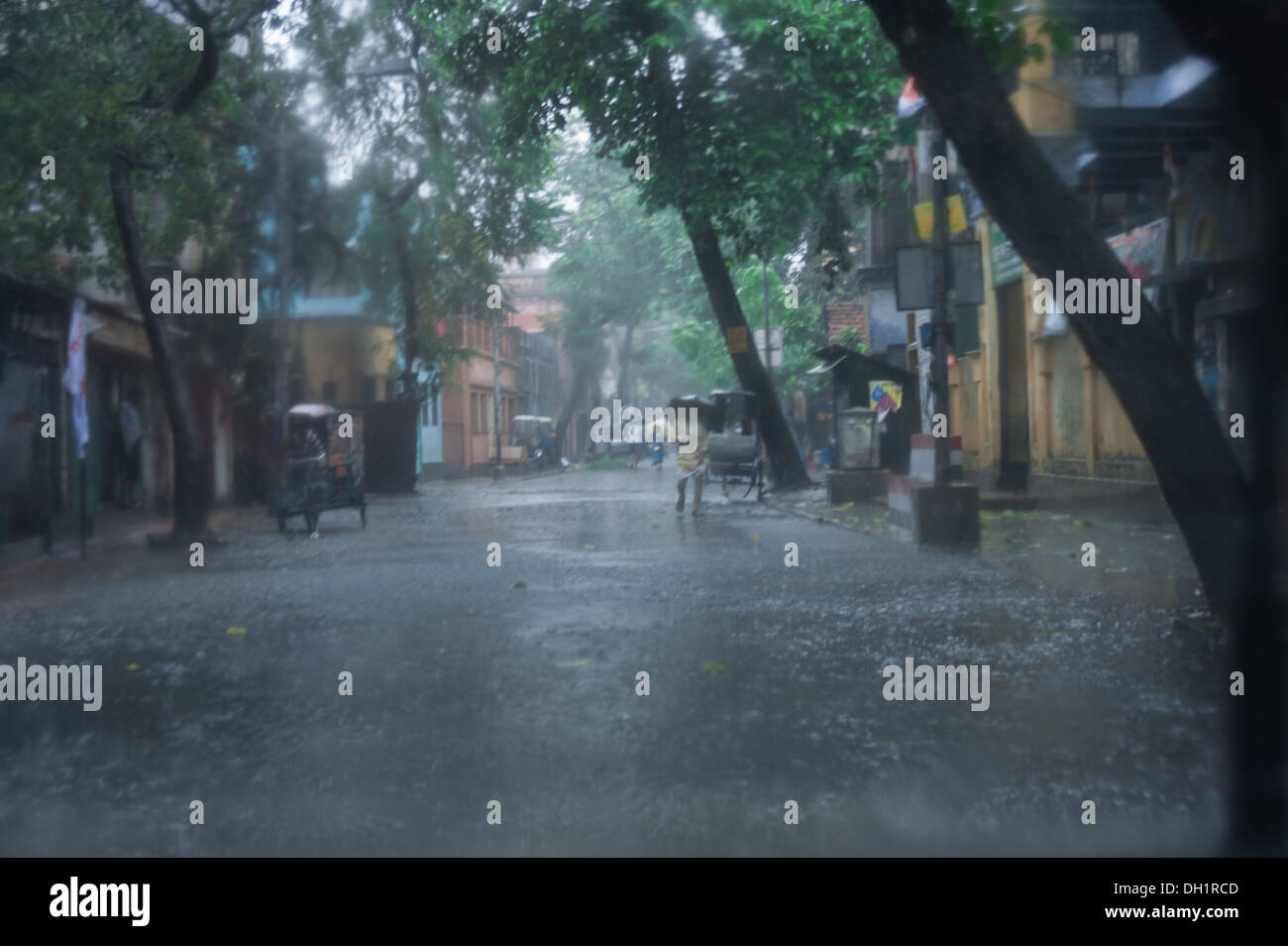 Man walking street monsoon raining rainfall Kolkata west bengal India ...