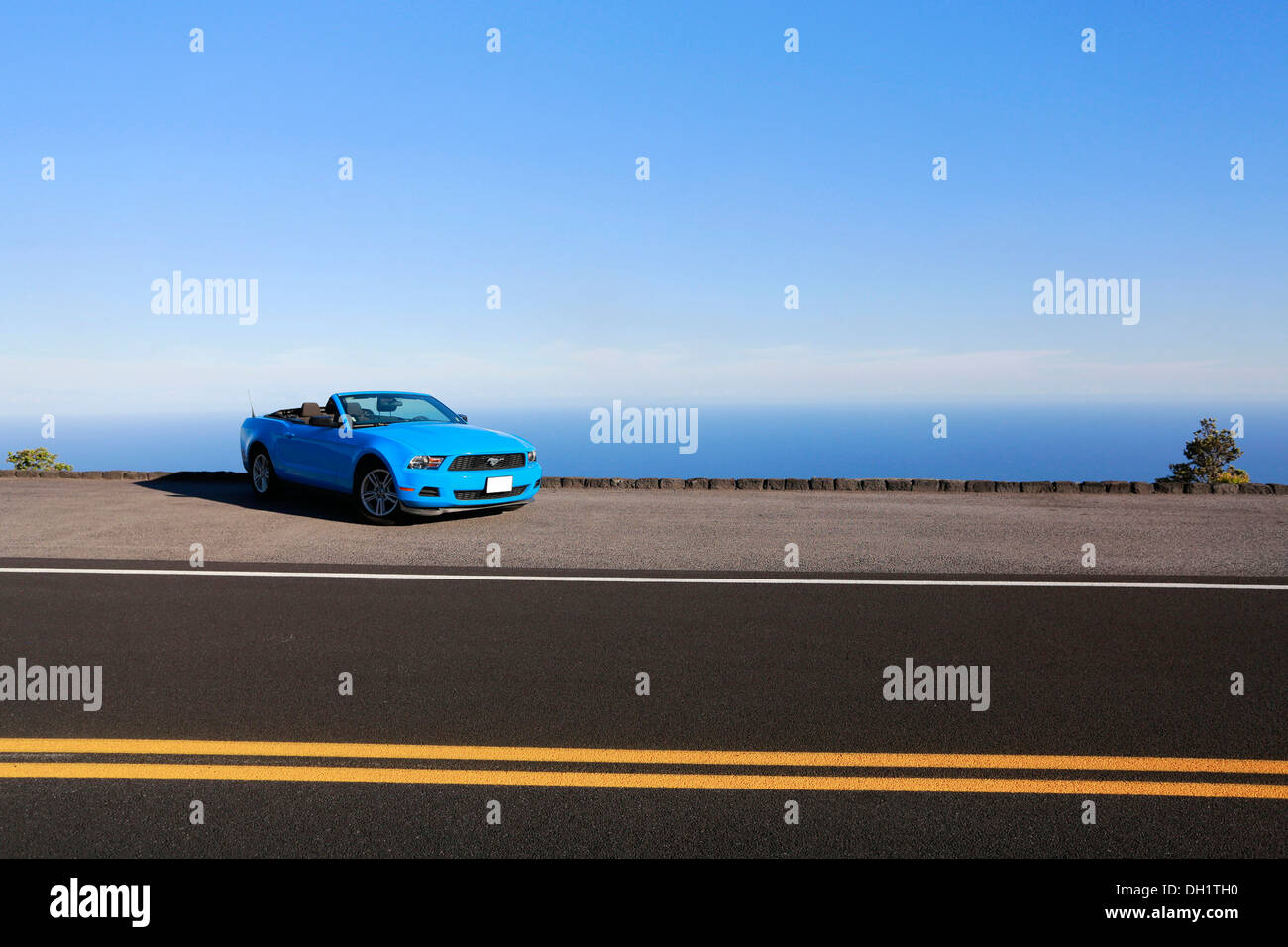 Sky-blue Ford Mustang convertible by the sea, Big Island, Hawaii, USA ...