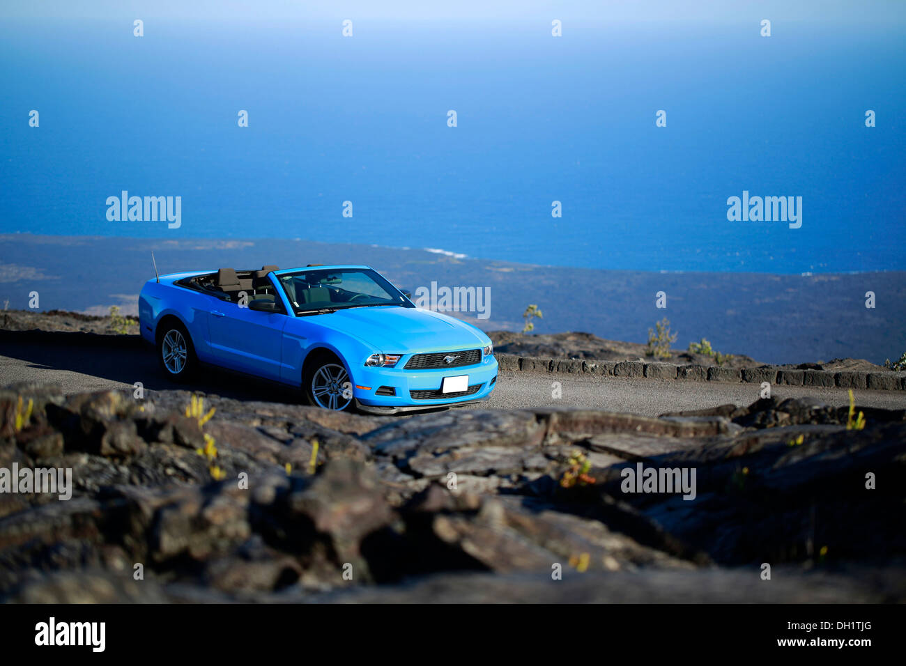 Sky-blue Ford Mustang convertible by the sea, Big Island, Hawaii, USA ...