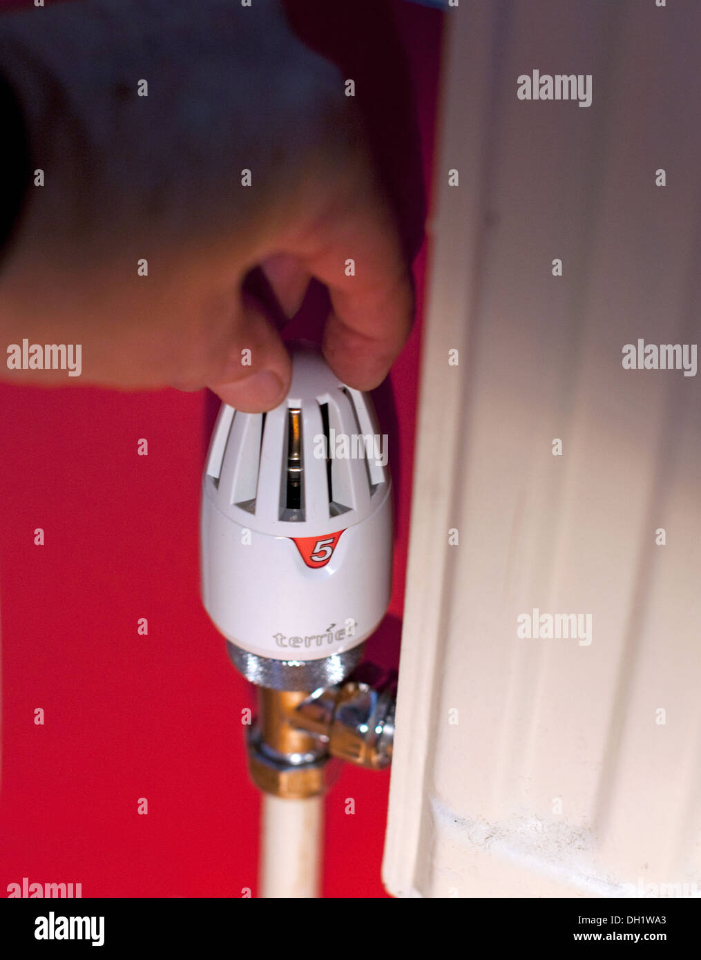 Adjusting thermostatic radiator valve, London Stock Photo - Alamy