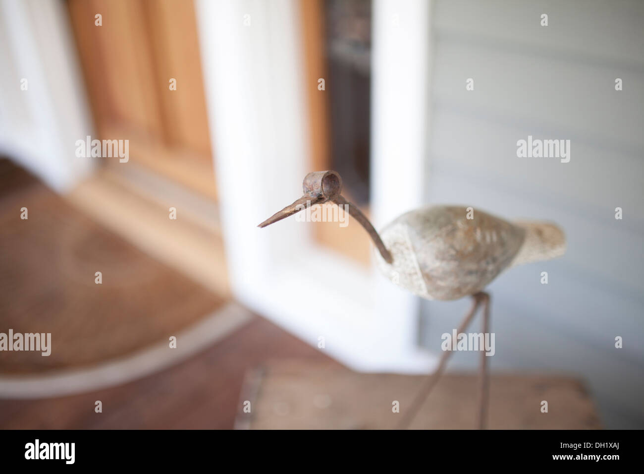 A bird adorns the front door of a country home Stock Photo - Alamy