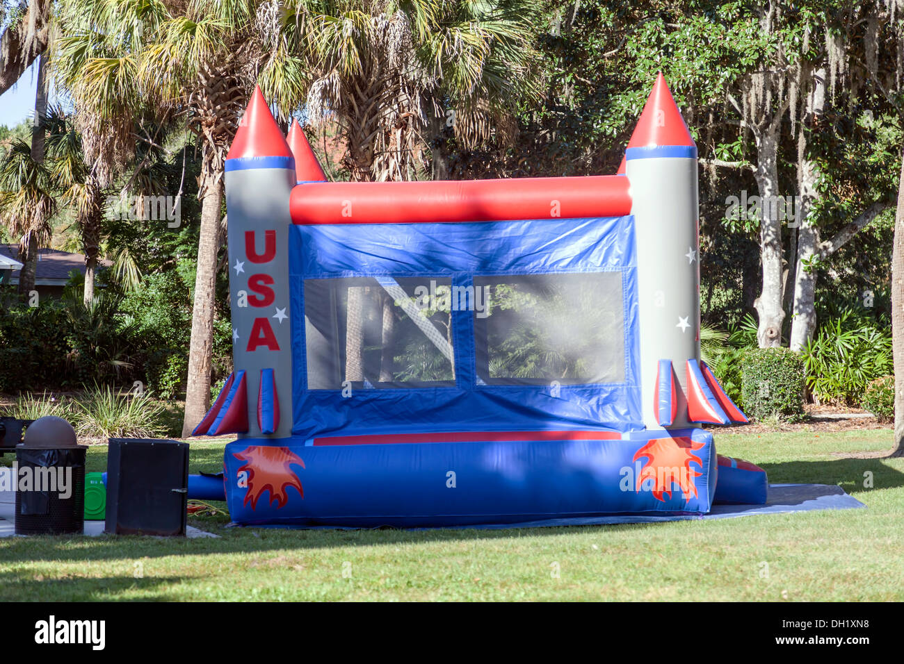 Inflatable USA rockets bounce house game set up in a public park in ...