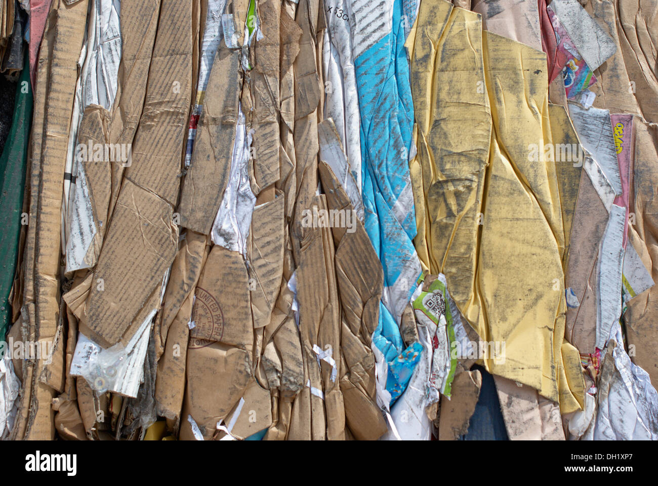 Cardboard that has been compacted in a baling machine Stock Photo - Alamy