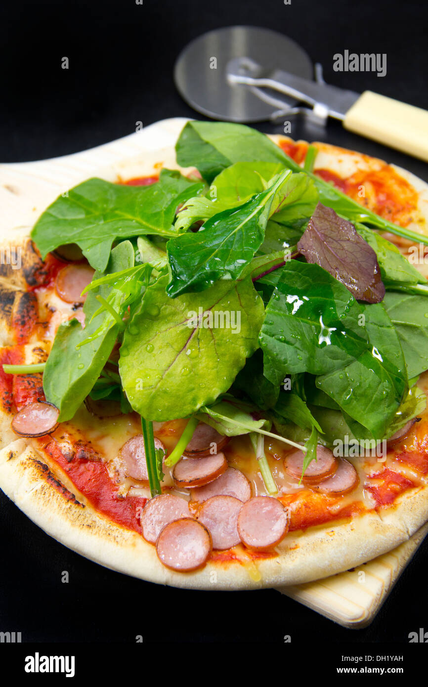 Pizza with rocket Stock Photo - Alamy