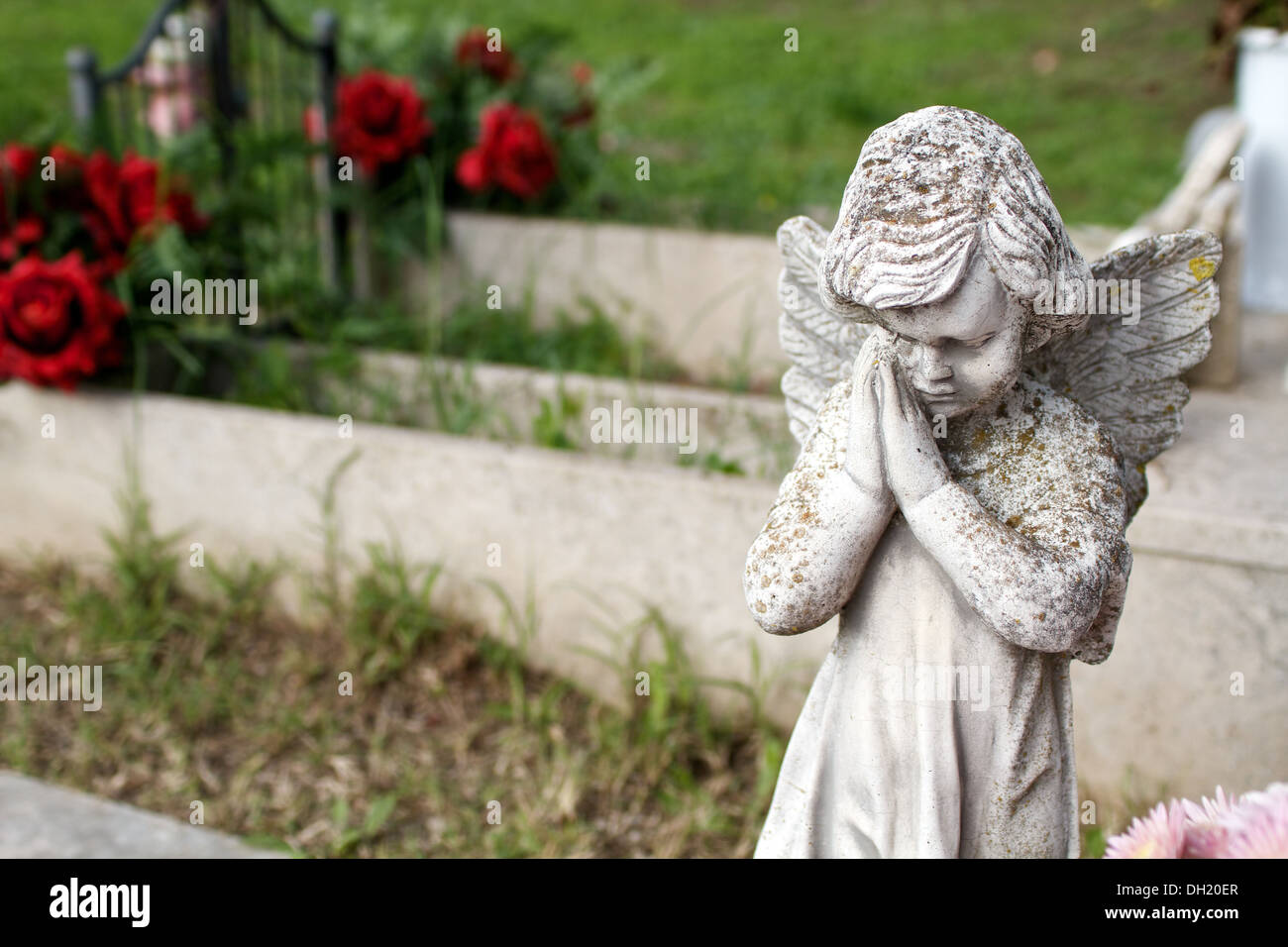 Angel in cemetery, with crosses in background Stock Photo - Alamy