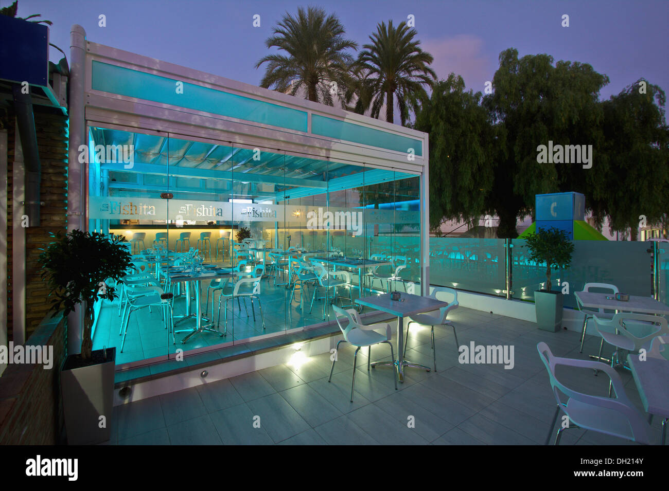 Modern glass restaurant in southern Spain, lit at night Stock Photo - Alamy