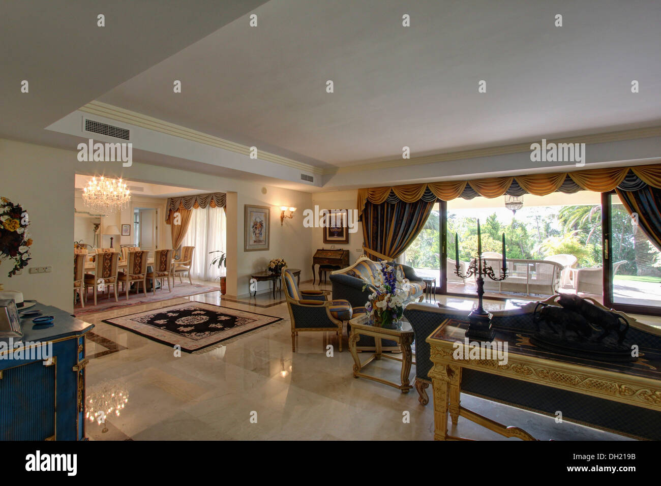 Travertine tiled floor in large open-plan Spanish living and dining ...