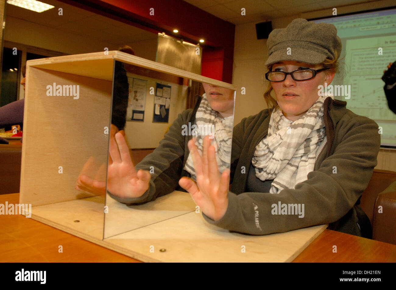 Female subject being tricked by a perceptual illusion, it play with the ...