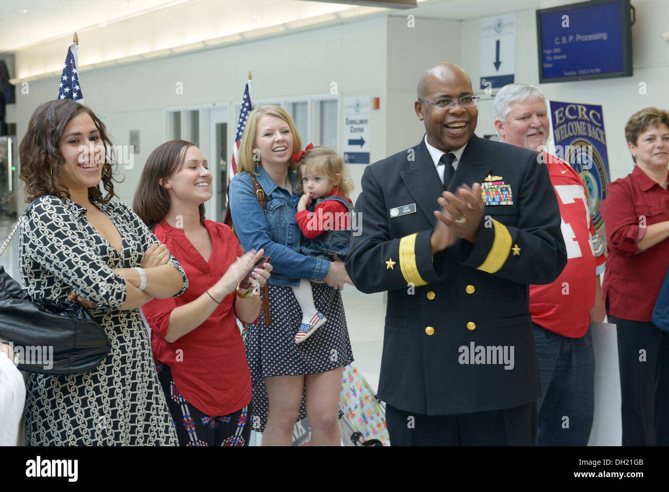 Rear Adm. Eric Young, deputy chief of Naval Reserve stands with ...