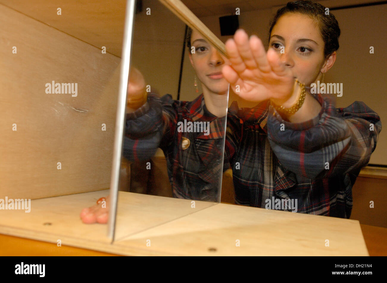 Female subject being tricked by a perceptual illusion, it play with the ...