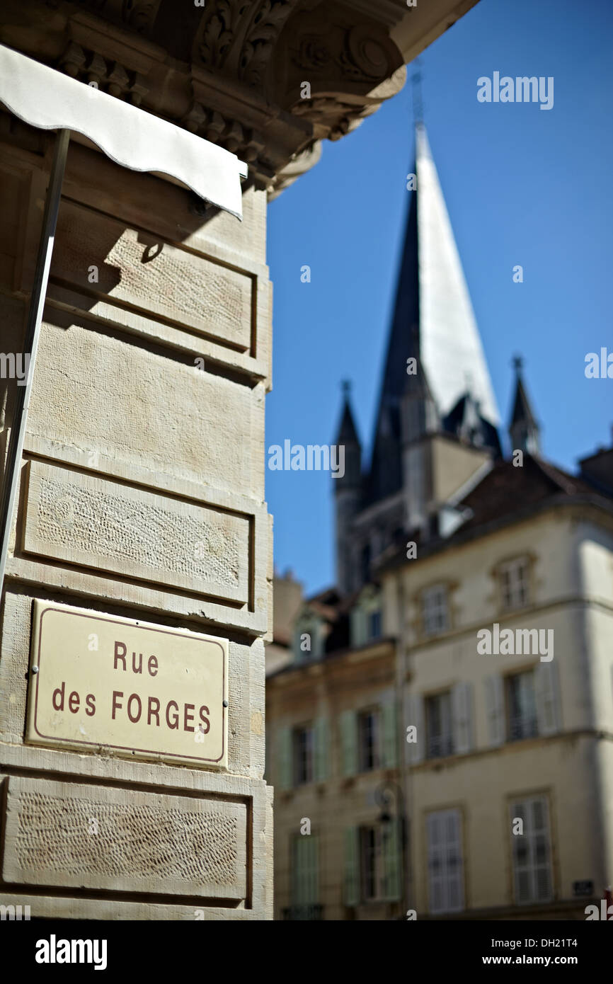 Photograph of Rue des Forges street sign with the Eglise Notre Dame in ...