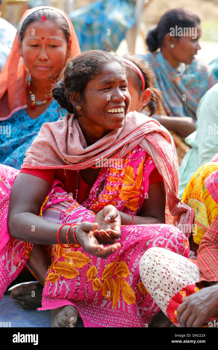 Women taking part in a village assembly, deprived community near ...