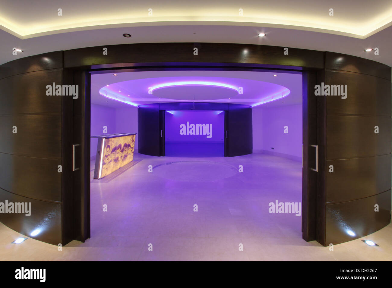 Double doors open to reception area in modern office building in ...