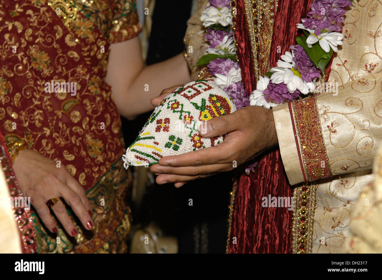 Bride and Groom dressed in all their finery celebrating their ...