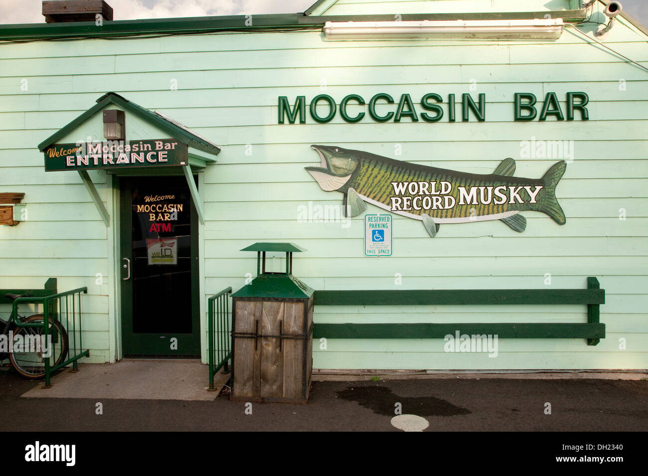 Entrance to the Moccasin Bar - World Record Musky replica on building ...